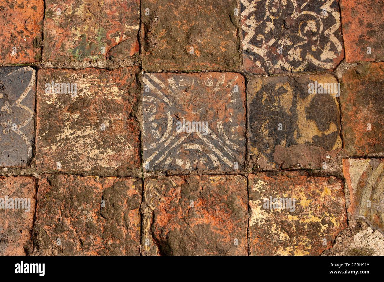Medieval clay floor tiles with hand painted patterns. Old floor tiles ...