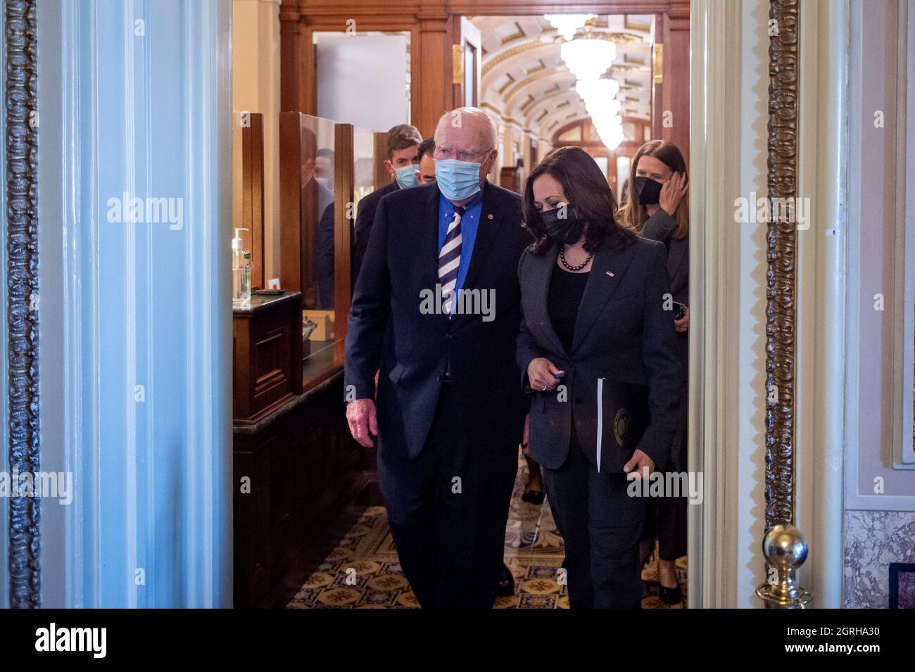 United States Vice President Kamala Harris walks with United States ...