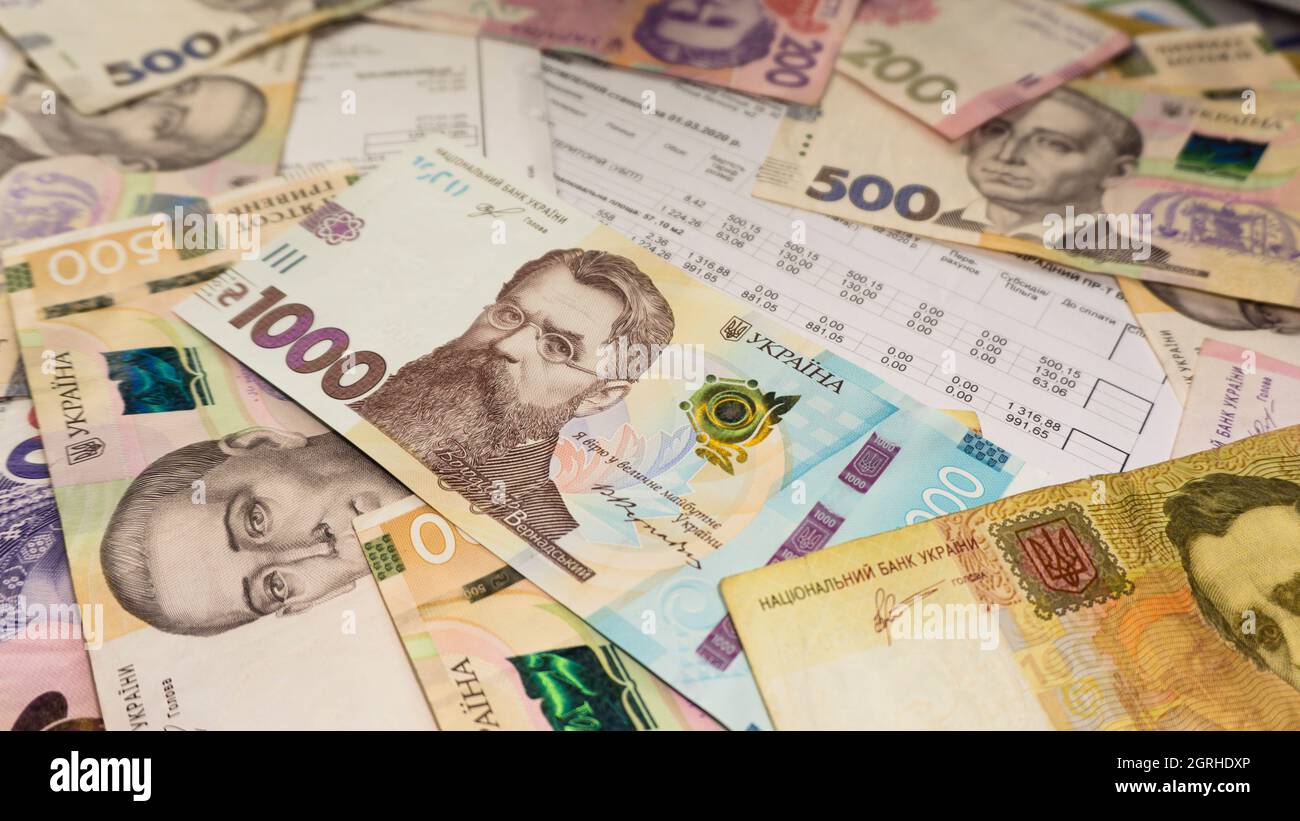 Ukrainian money hryvnia and coins penny wooden background, utility bill ...