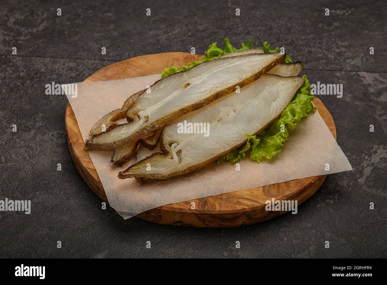 Delicous smoked halibut fish slices snack Stock Photo - Alamy