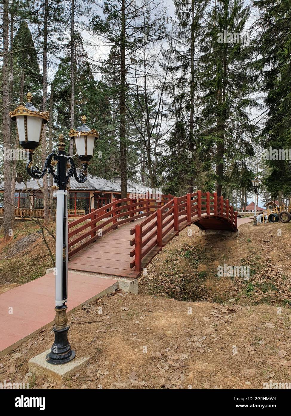 Wooden bridge in a park Stock Photo - Alamy