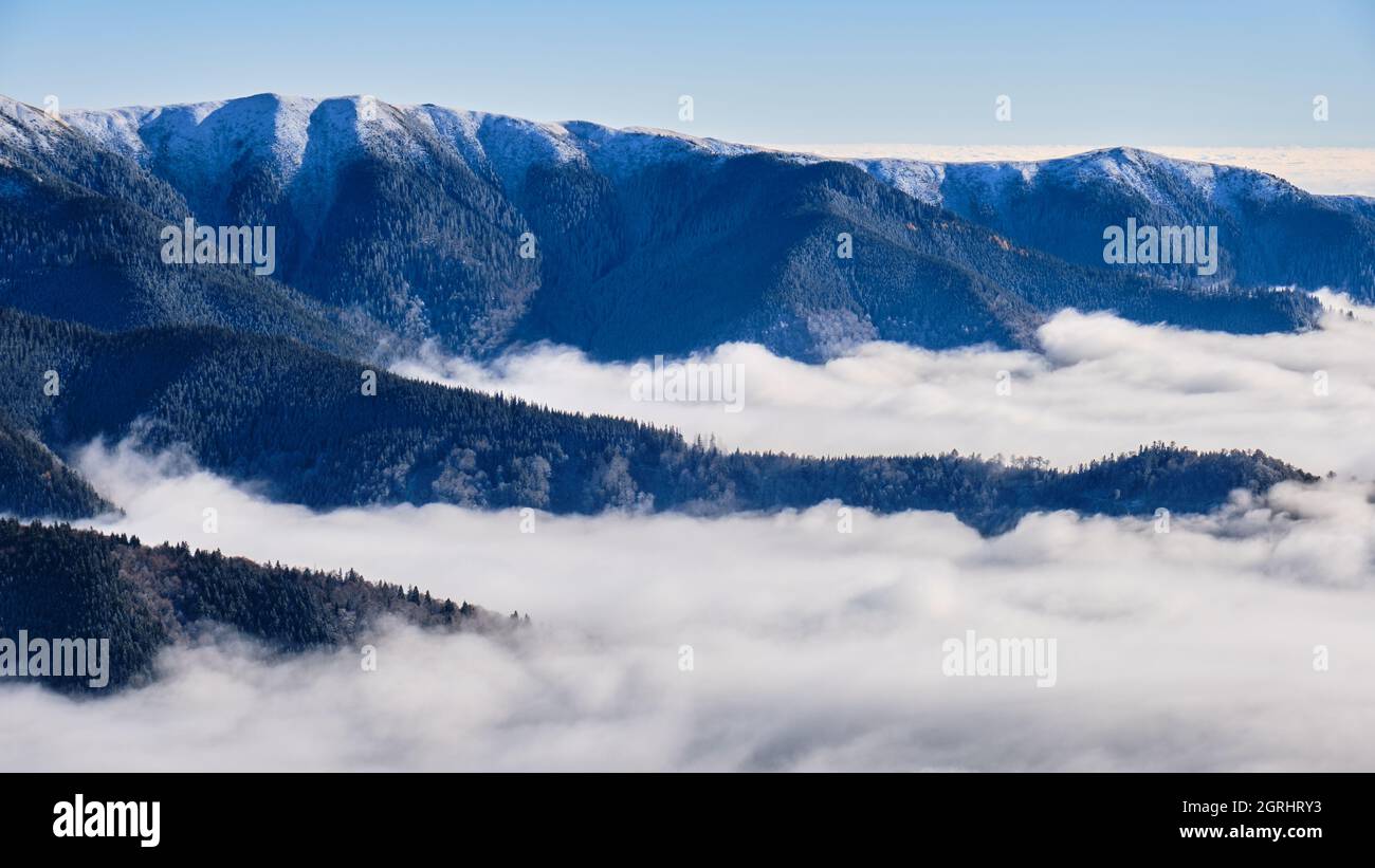 Sea of clouds in the mountains created by temperature inversion. View ...