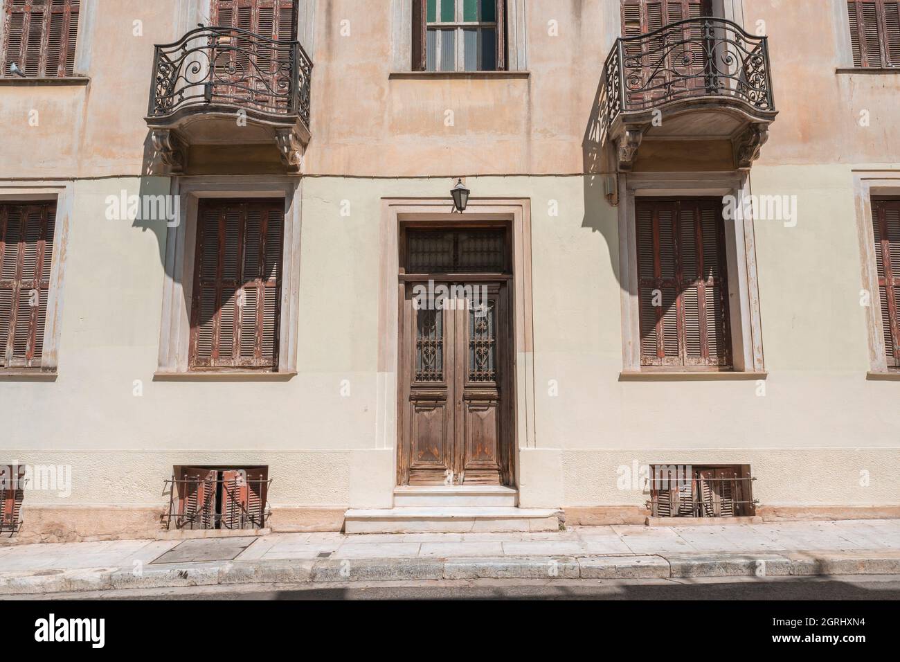 Facade view of classical Greek building with windows and doors Stock ...