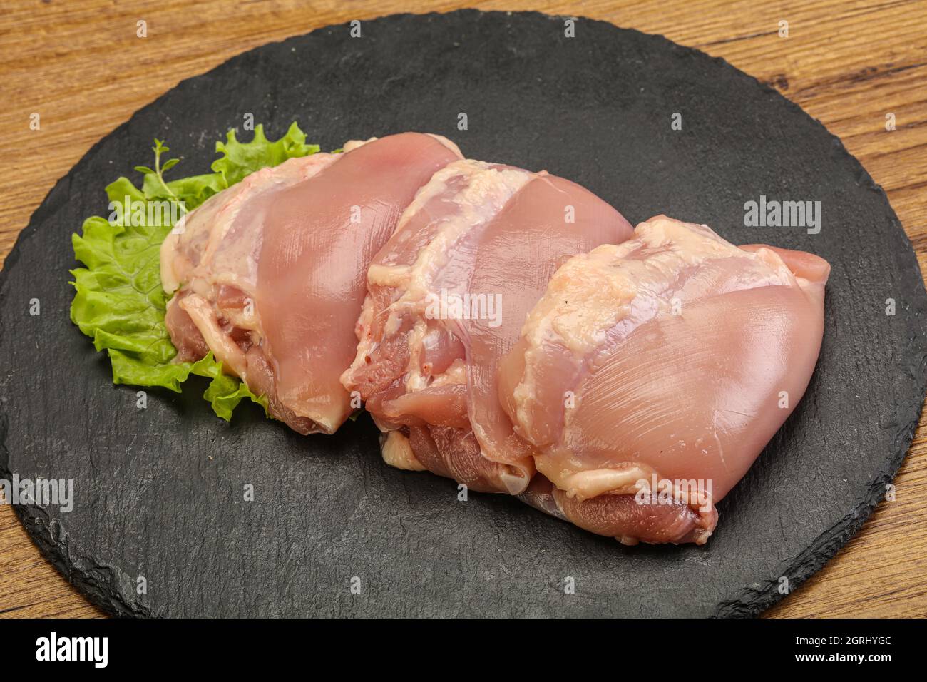 Raw chicken boneless and skinless leg for cooking Stock Photo - Alamy