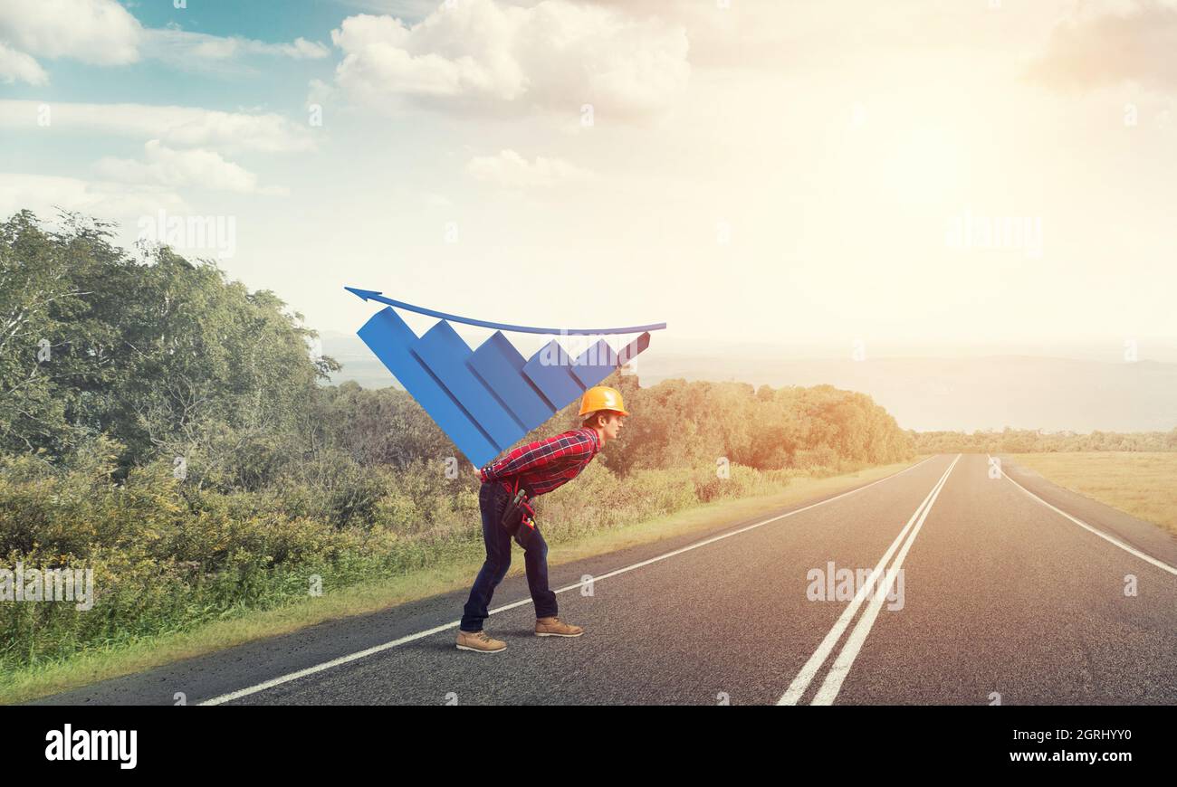 Engineer man carry progress graph Stock Photo - Alamy