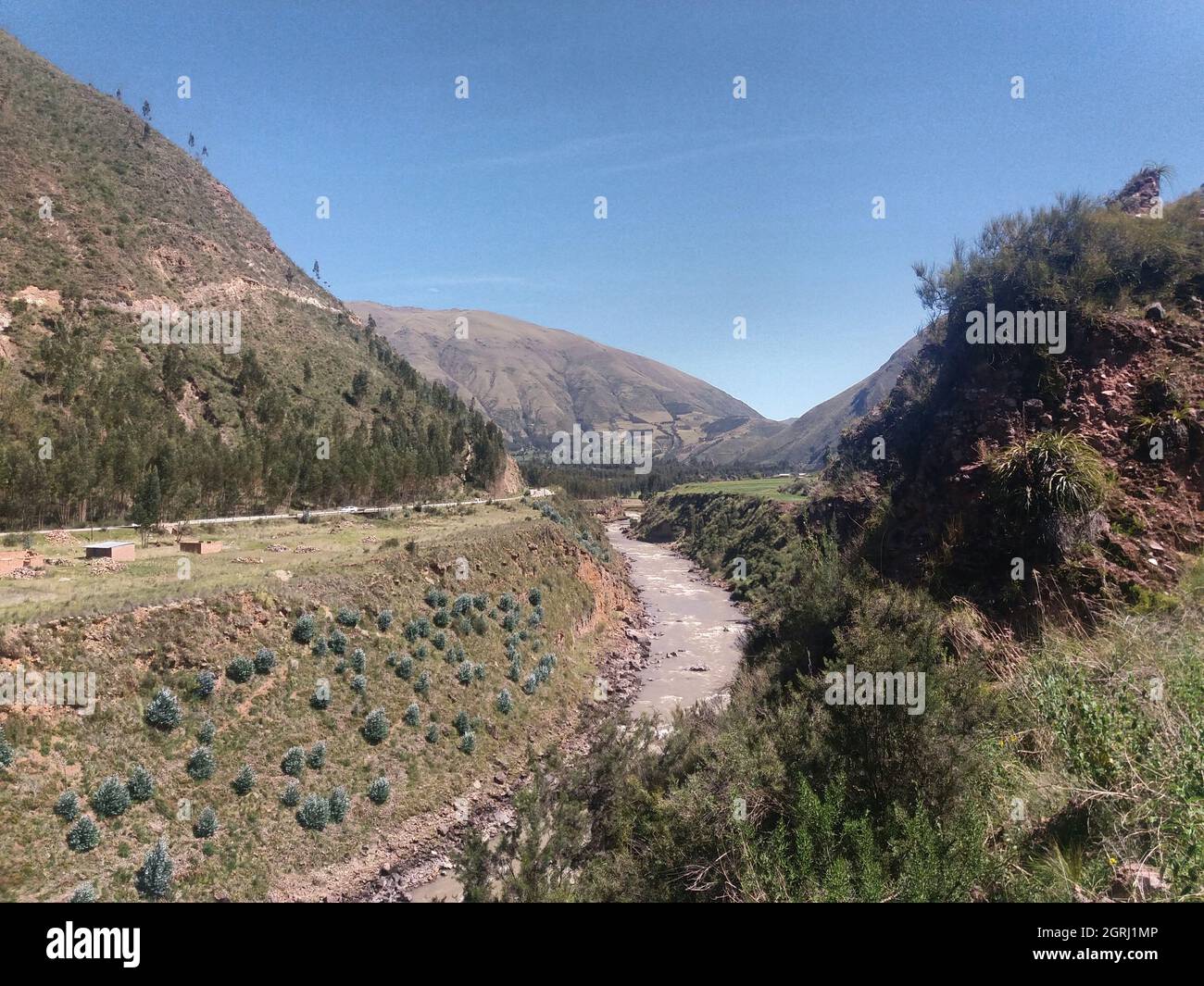 Aerial view of a dirty river running through the mountains Stock Photo ...
