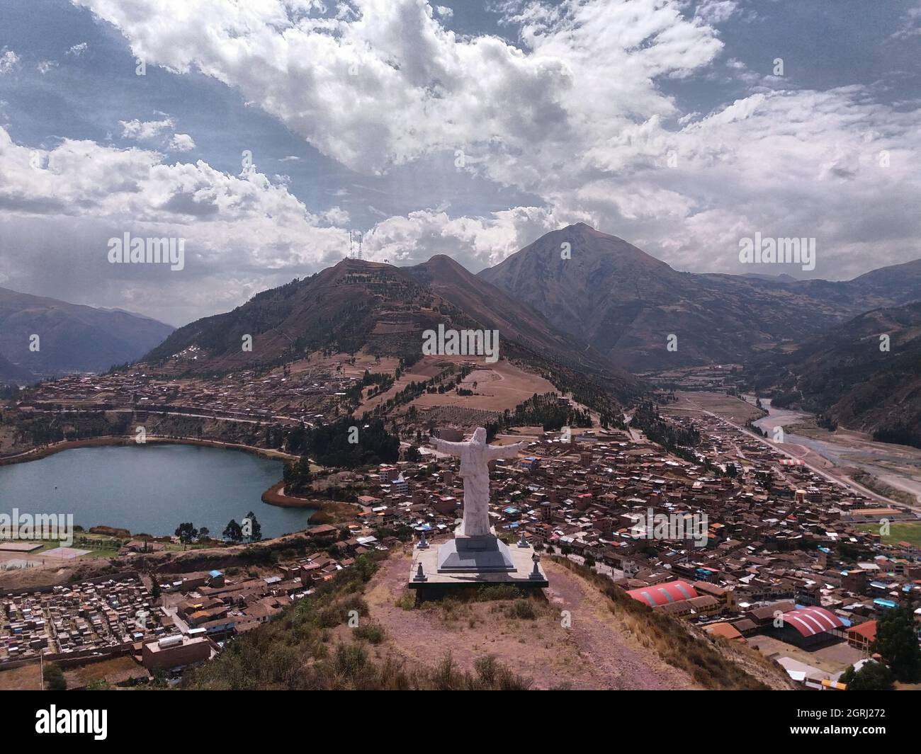 Aerial view of Cristo Blanco statue on a hill under the cloudy sky ...