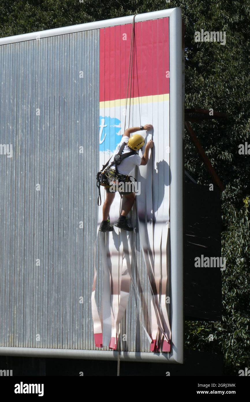 Changing billboard advertising hi-res stock photography and images - Alamy