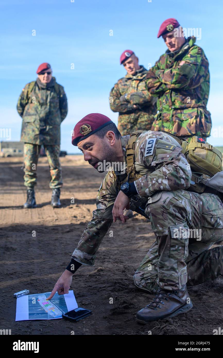 01 October 2021, Saxony-Anhalt, Klietz: A Dutch Army officer points to ...