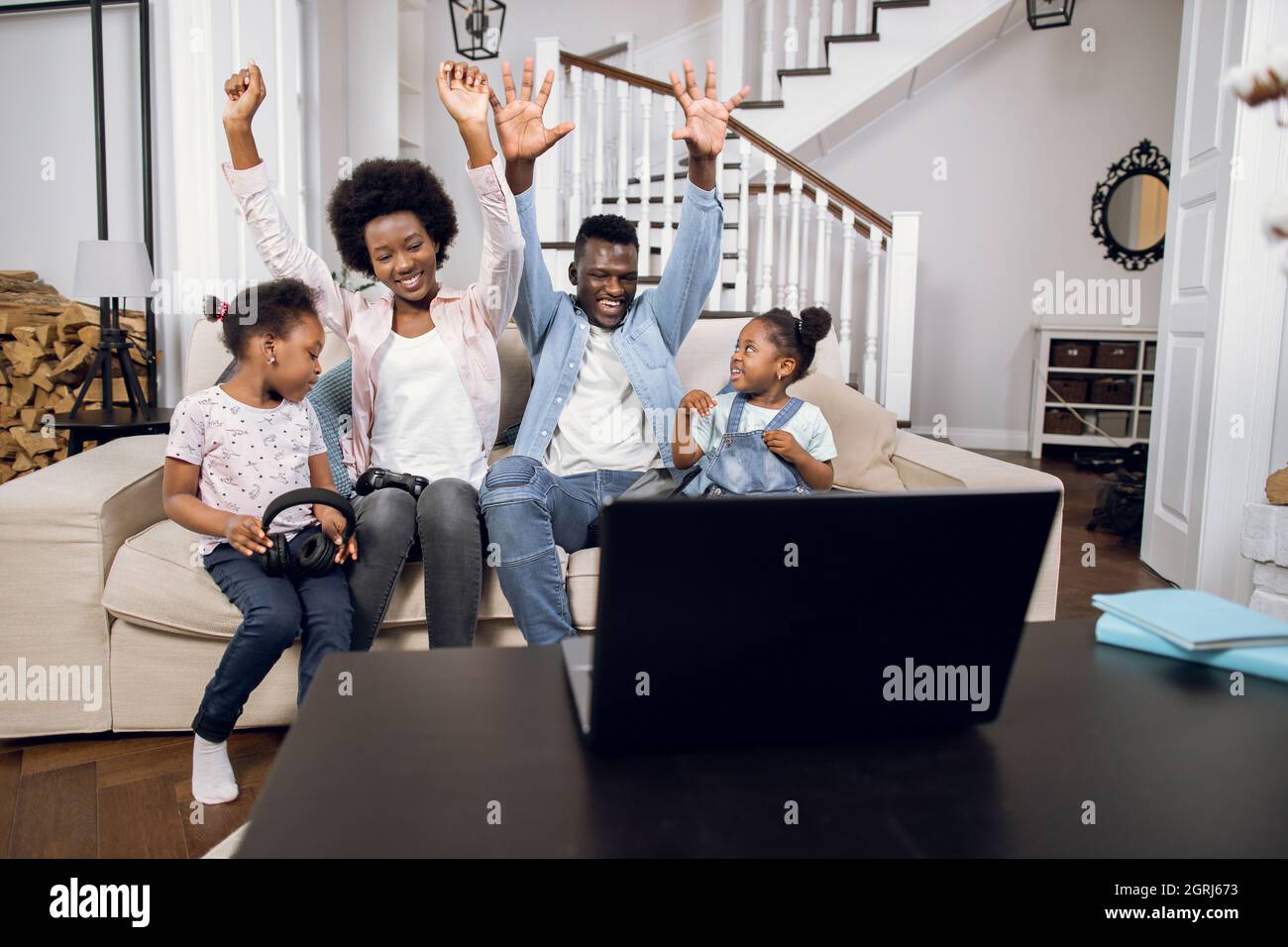 Competitive family playing video games hi-res stock photography and ...