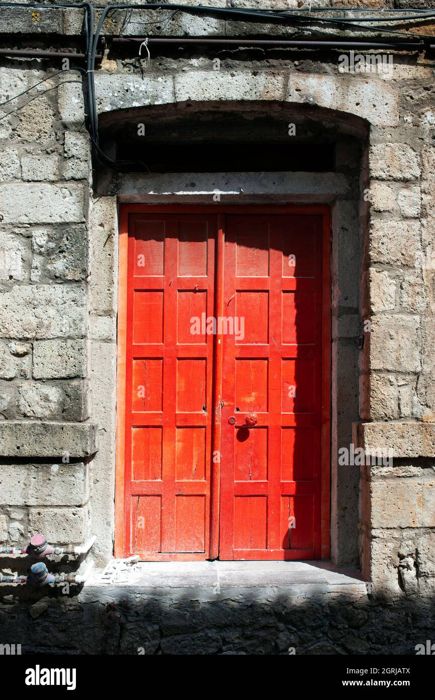 Closed red door of a historic building Stock Photo - Alamy