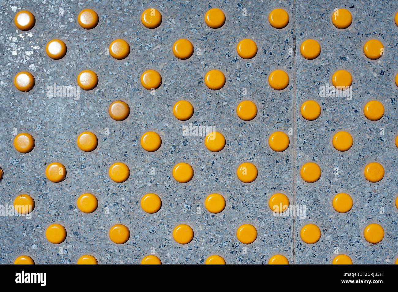 Yellow circles on the ground Stock Photo - Alamy