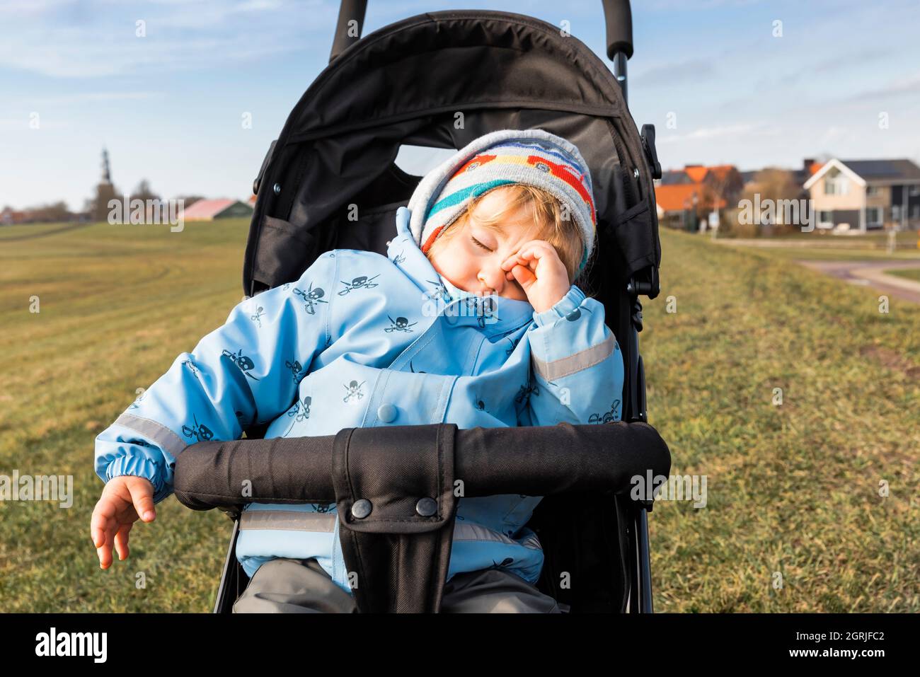 Baby sleeping on stroller in hi-res stock photography and images - Alamy