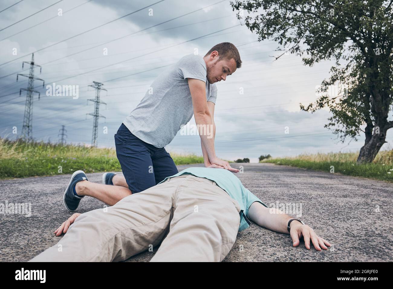 Man giving first aid young hi-res stock photography and images - Alamy