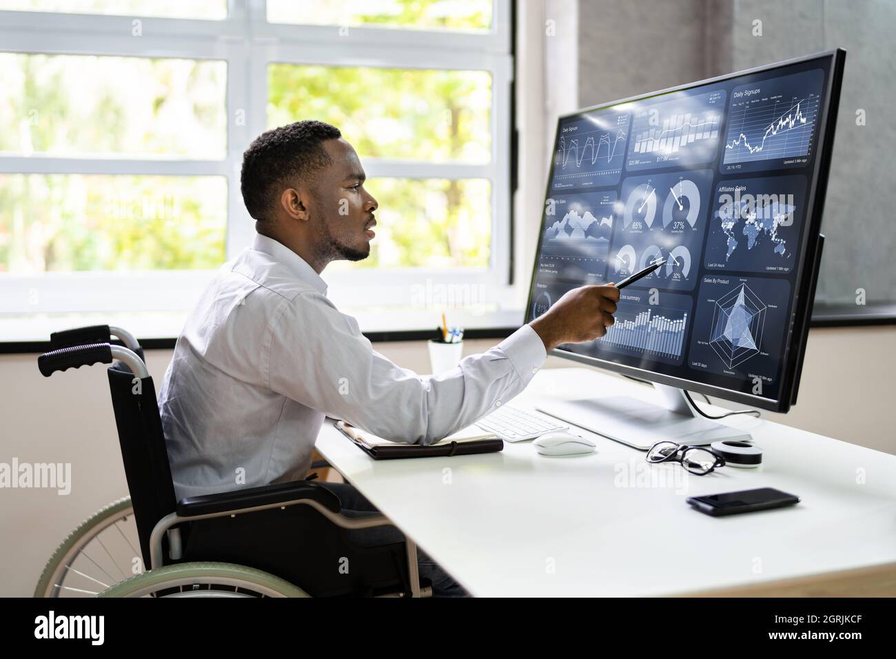 Business Data Analyst Using Computer. African American Advisor Stock ...