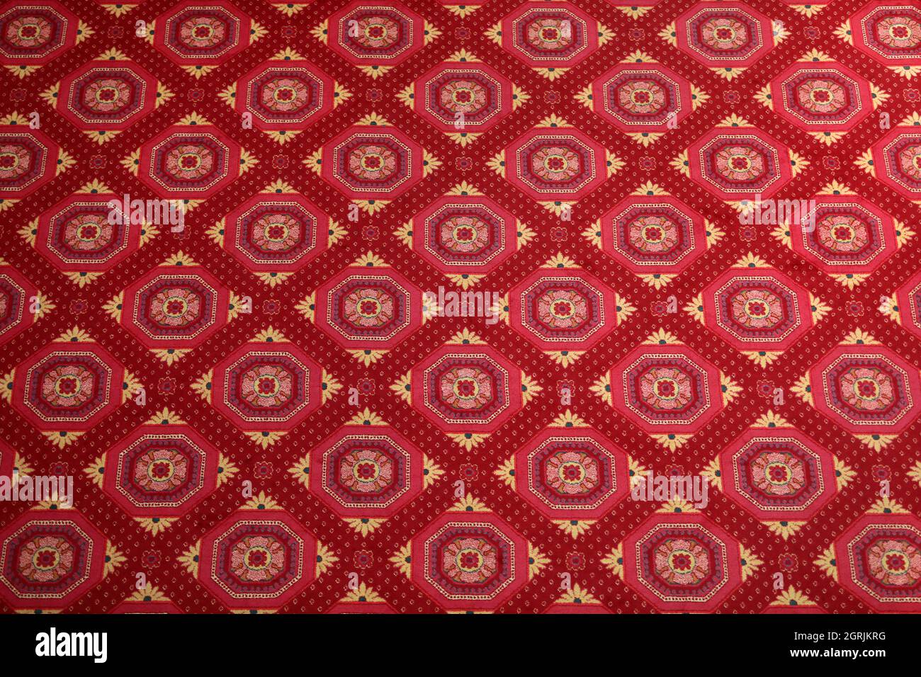 Large red carpet with checkered patterns Stock Photo - Alamy