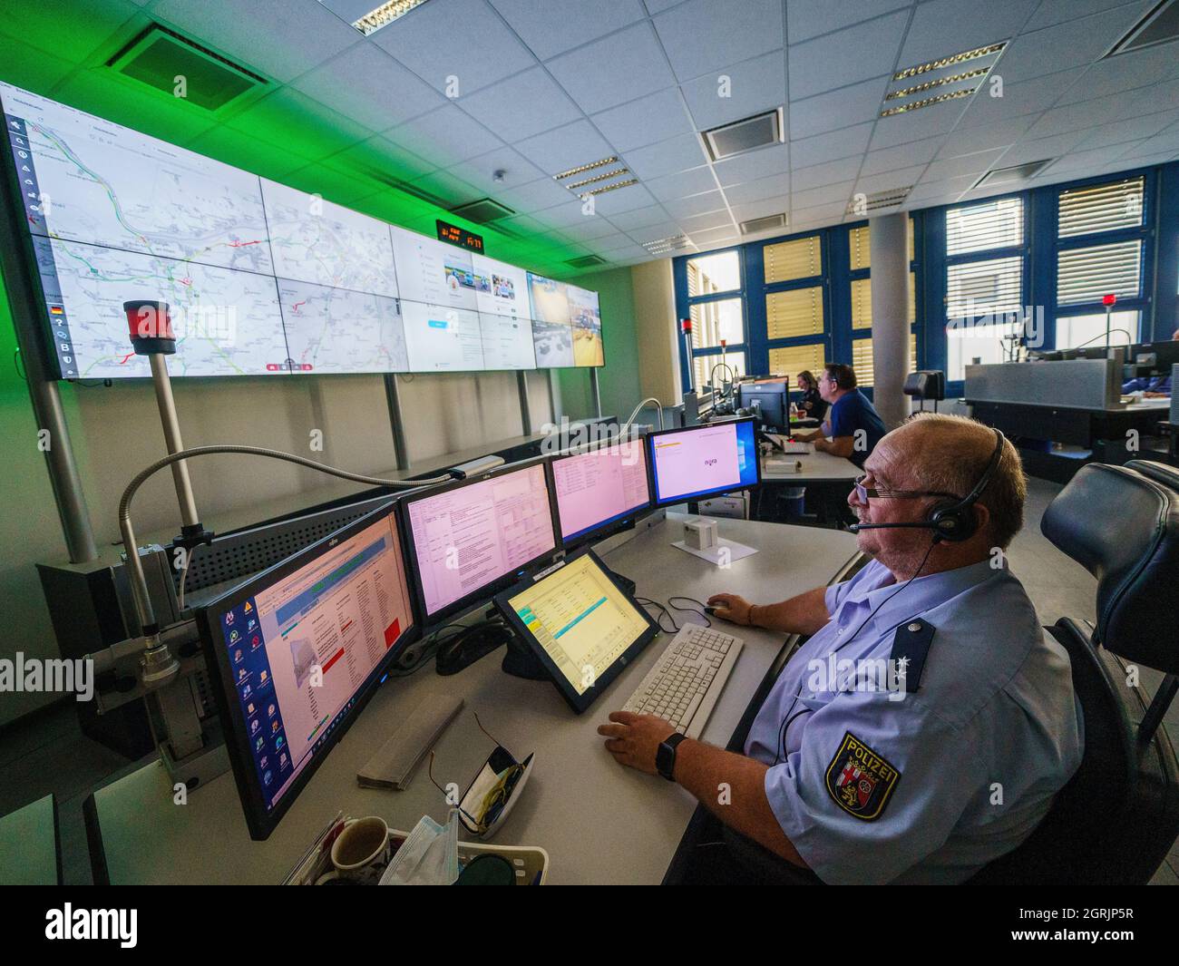 Mainz, Germany. 01st Oct, 2021. A police officer sits at his ...