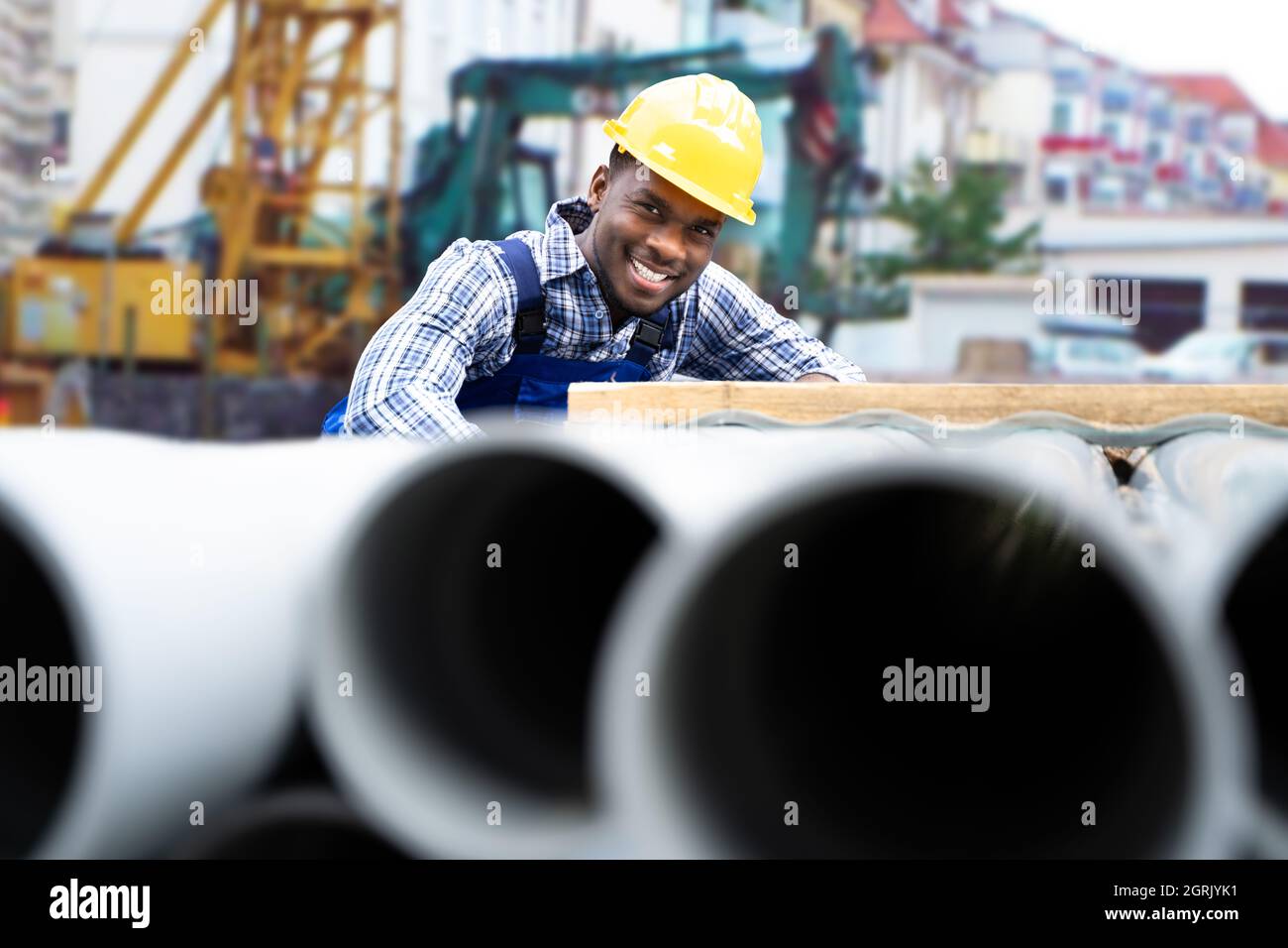 Construction Worker Builder Working At Site. Pipes And Sewage Stock ...