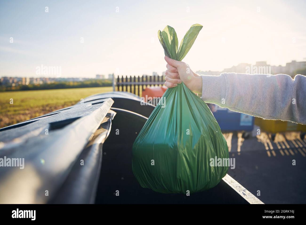 Man carrying trash bag hi-res stock photography and images - Alamy