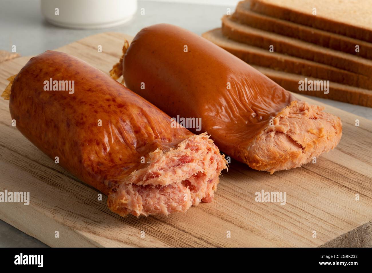 Traditional German coarse and fine Teewurst open in plastic close up ...