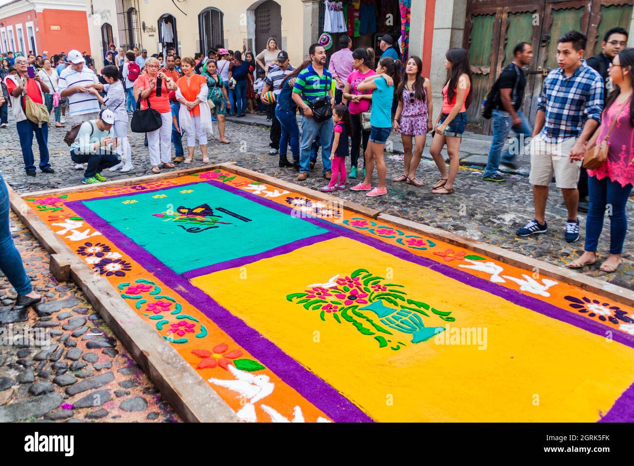 ANTIGUA, GUATEMALA - MARCH 25, 2016: People watch decorative Easter ...
