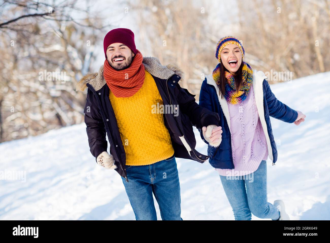 Photo of excited young couple happy positive smile go walk run park ...