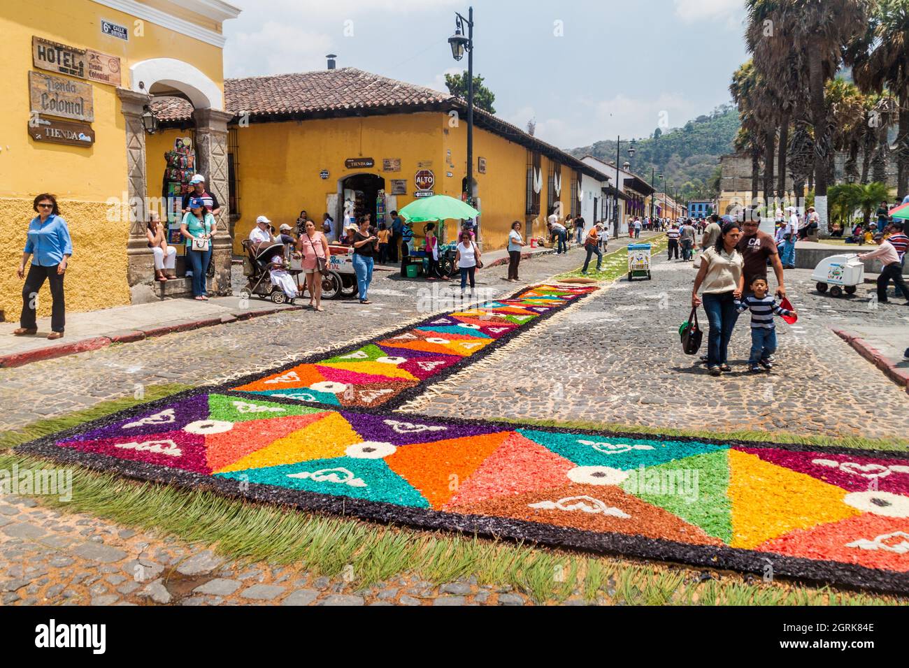 ANTIGUA, GUATEMALA - MARCH 27, 2016: People walk along decorative ...