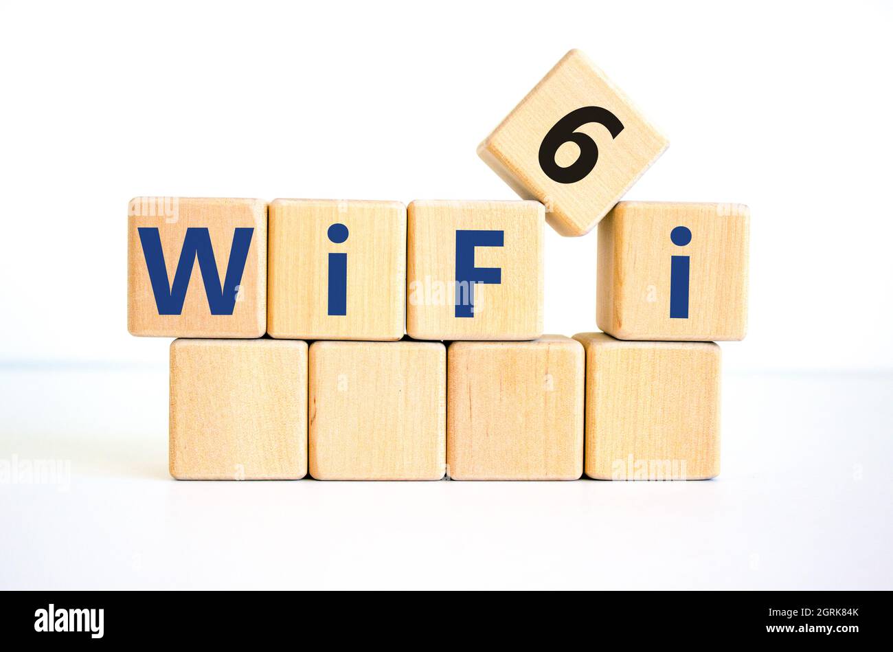 WiFi 6 symbol. The concept word WiFi 6 on wooden cubes. Beautiful white ...