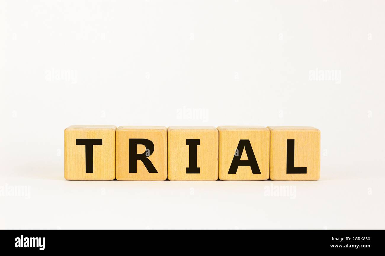 Trial symbol. The concept word 'trial' on wooden cubes on a beautiful ...