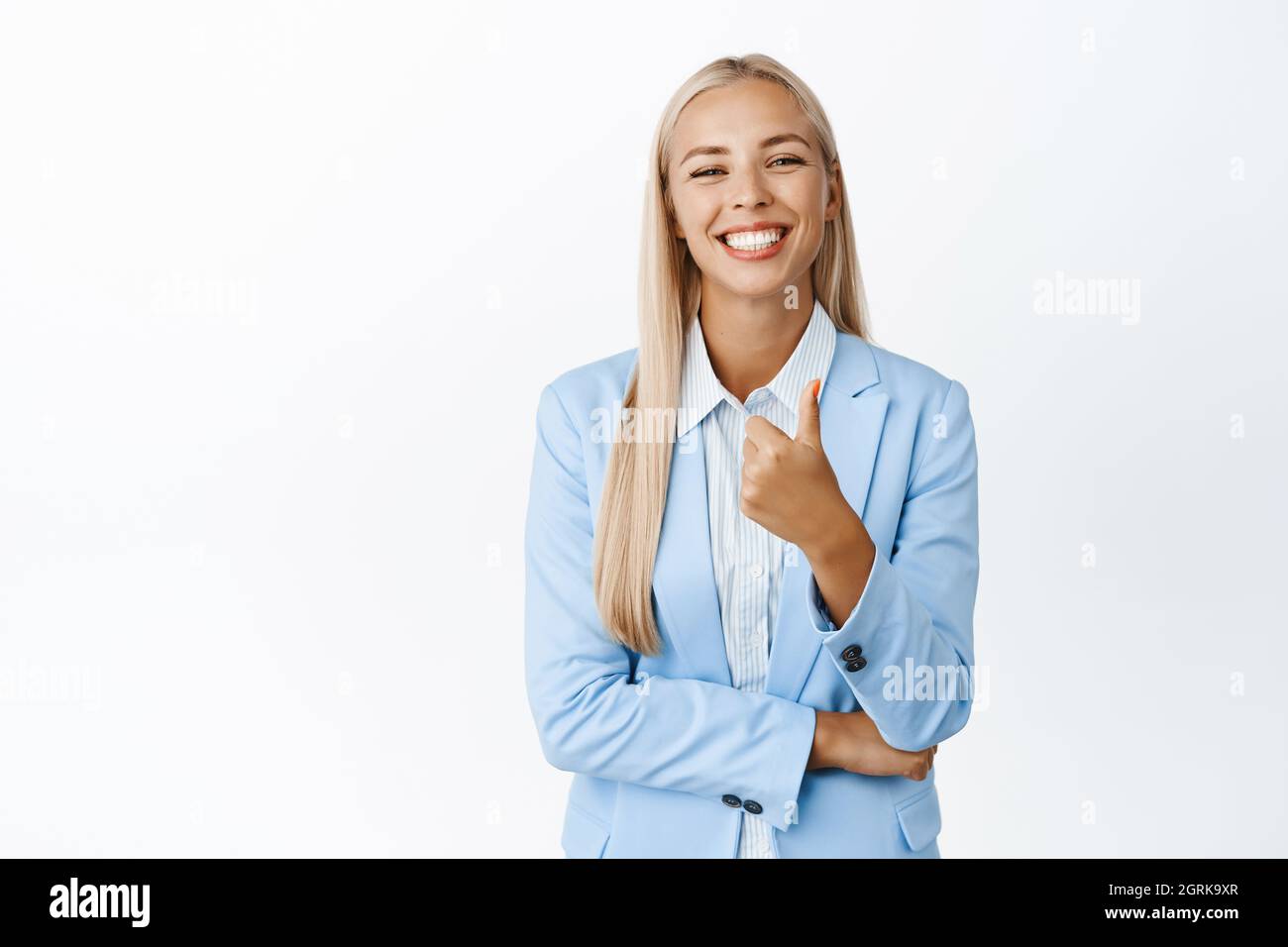Ambitious smiling corporate woman in suit, showing thumbs up ...