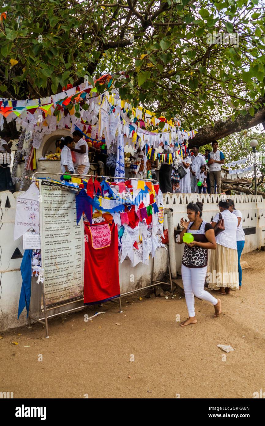 KANDY, SRI LANKA - JULY 19, 2016: White clothed buddhist pilgrims visit ...