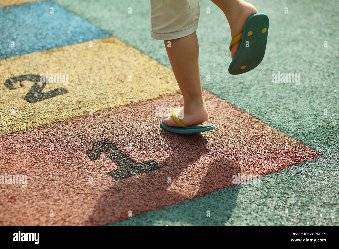 Boy playing hopscotch hi-res stock photography and images - Alamy