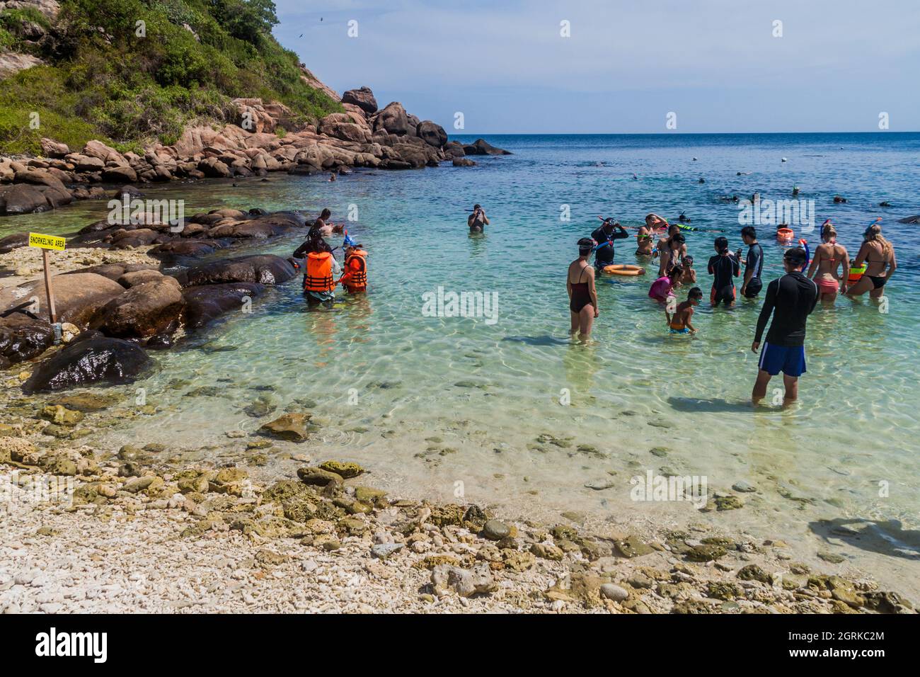 PIGEON ISLAND, SRI LANKA - JULY 25, 2016: People snorkel on a coral ...