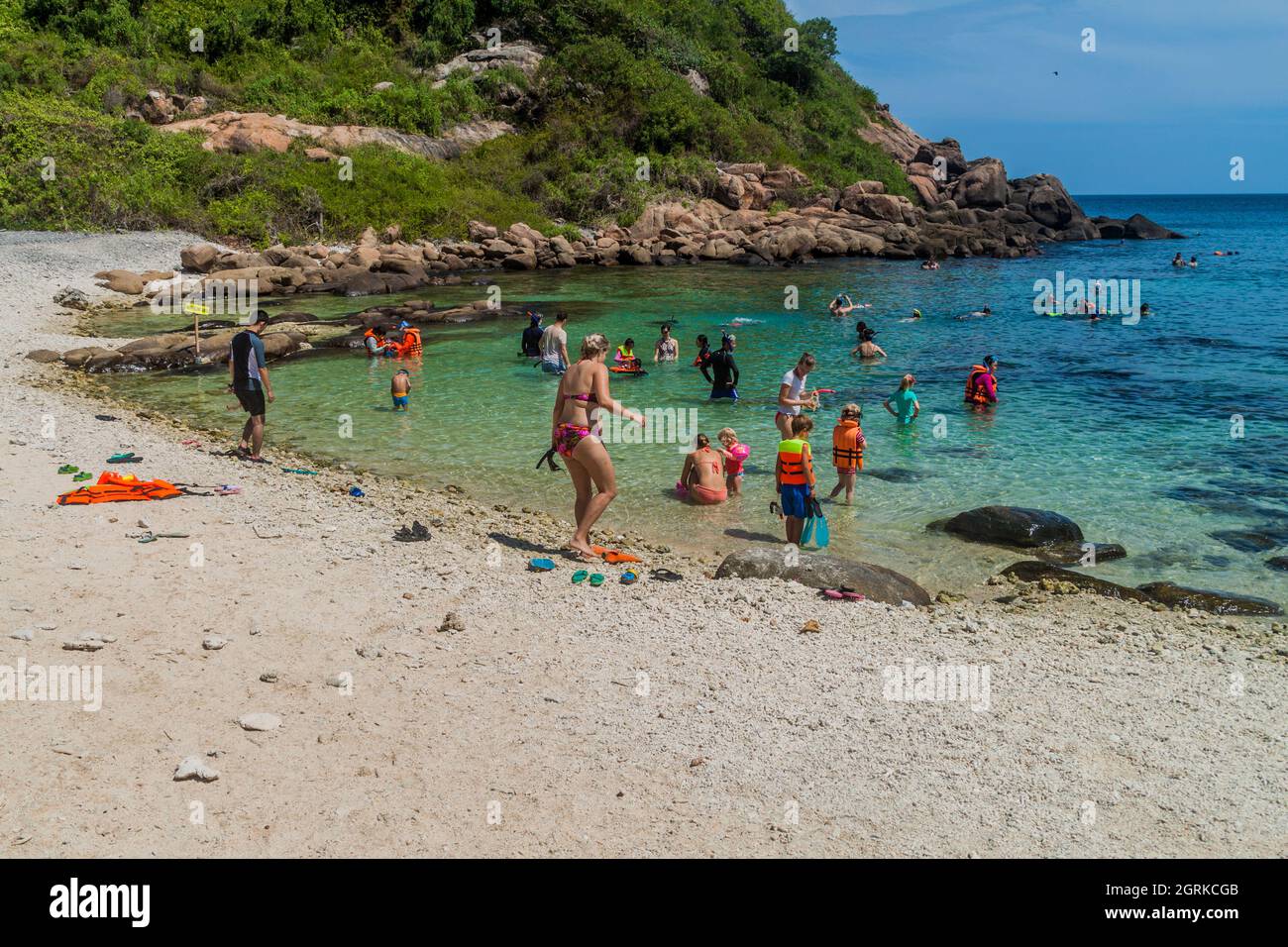 PIGEON ISLAND, SRI LANKA - JULY 25, 2016: People snorkel on a coral ...
