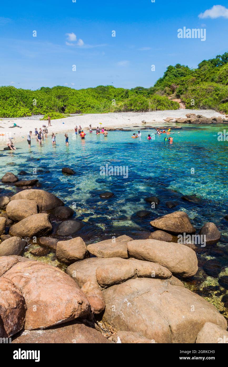 PIGEON ISLAND, SRI LANKA - JULY 25, 2016: People snorkel on a coral ...