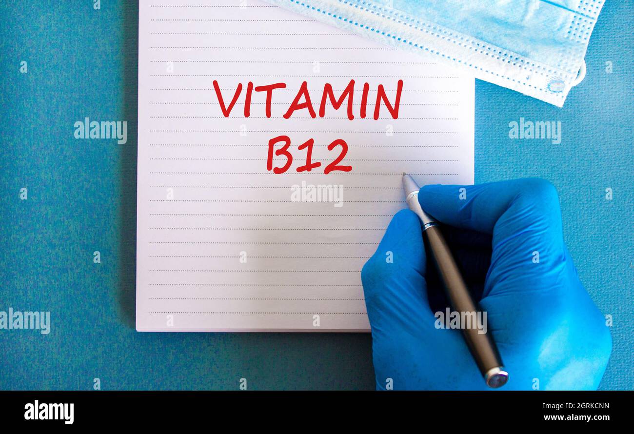 Vitamin B12 symbol. White note with words Vitamin B12, beautiful blue ...