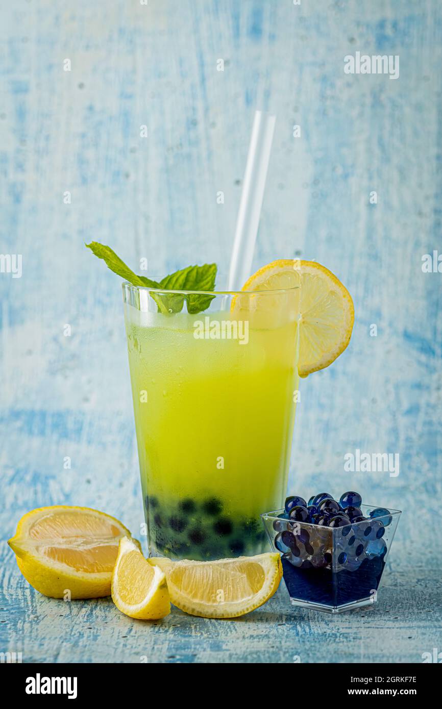 Lemonade with bubble tea on blue stone background Stock Photo - Alamy