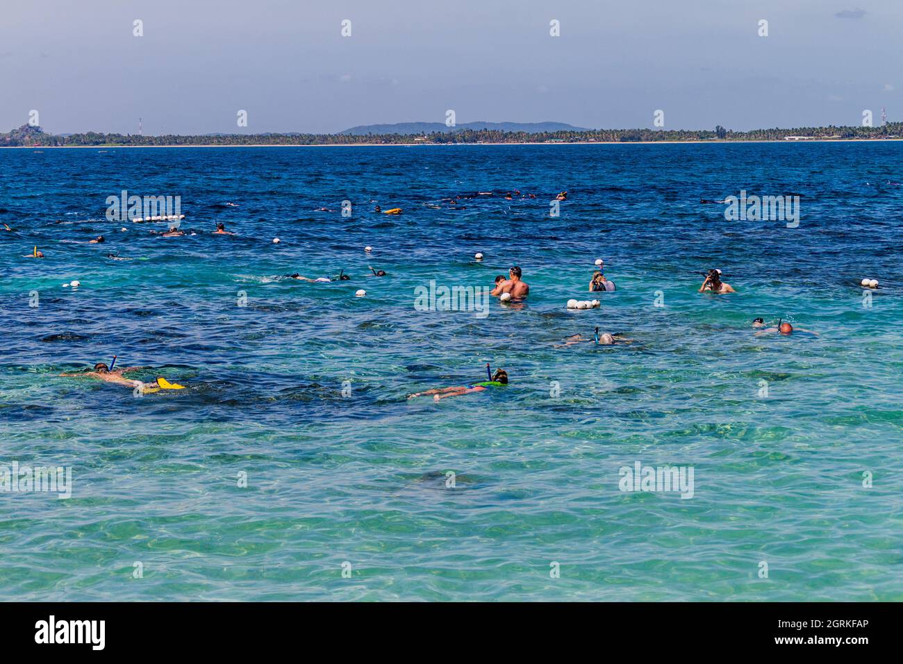 PIGEON ISLAND, SRI LANKA - JULY 25, 2016: People snorkel on a coral ...