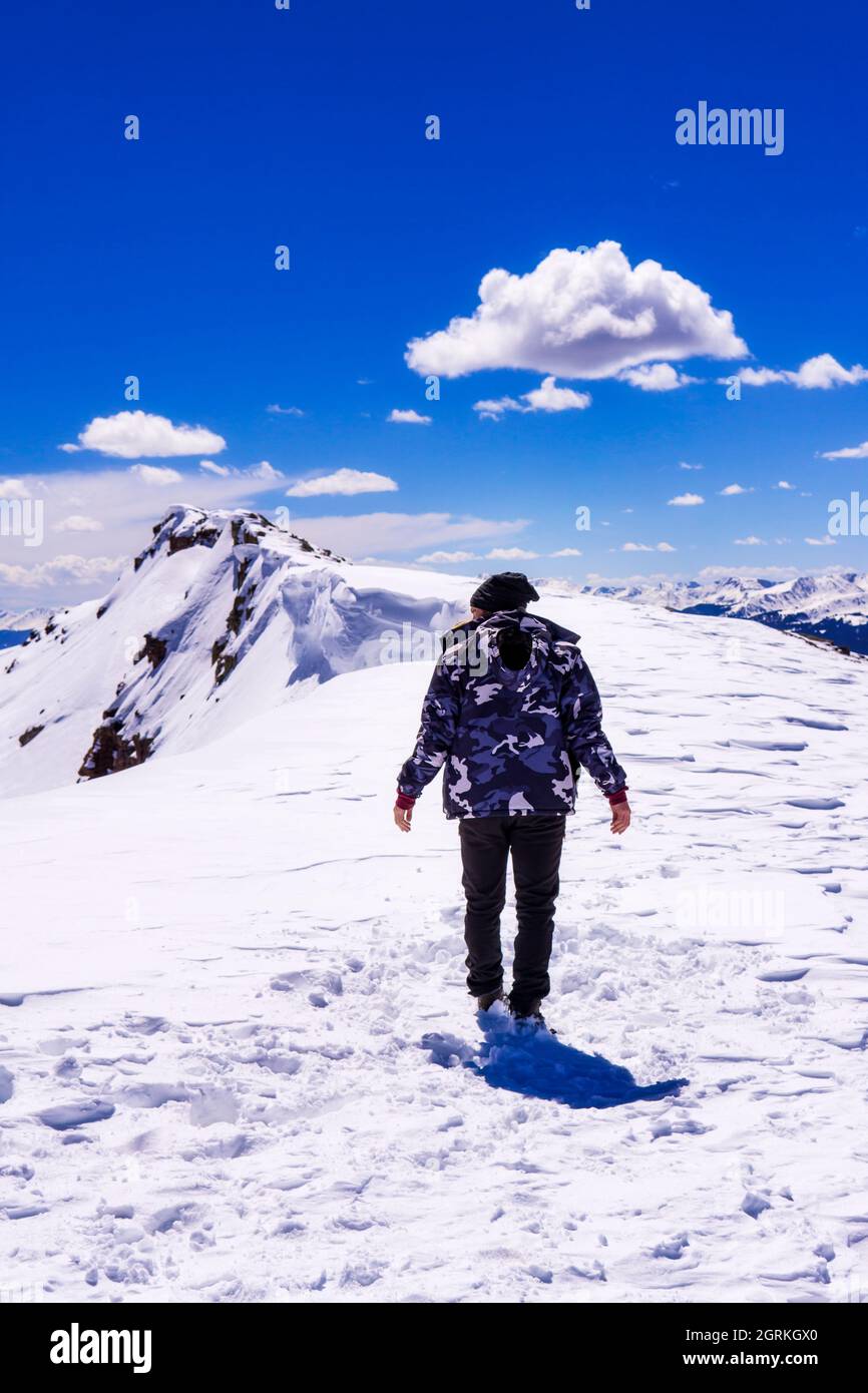 Winter Exploration On Snow Mountain Ridge Cliff Stock Photo - Alamy