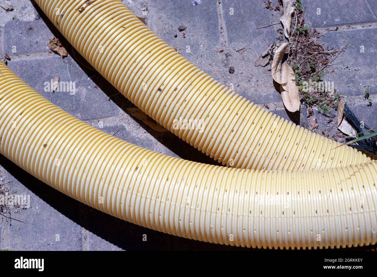 Yellow plastic pipes Stock Photo - Alamy