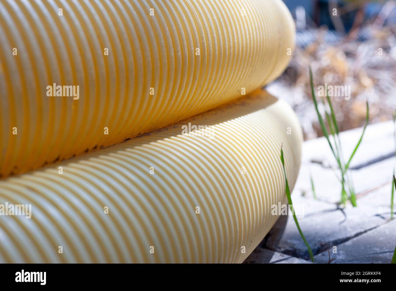 Yellow plastic pipes Stock Photo - Alamy
