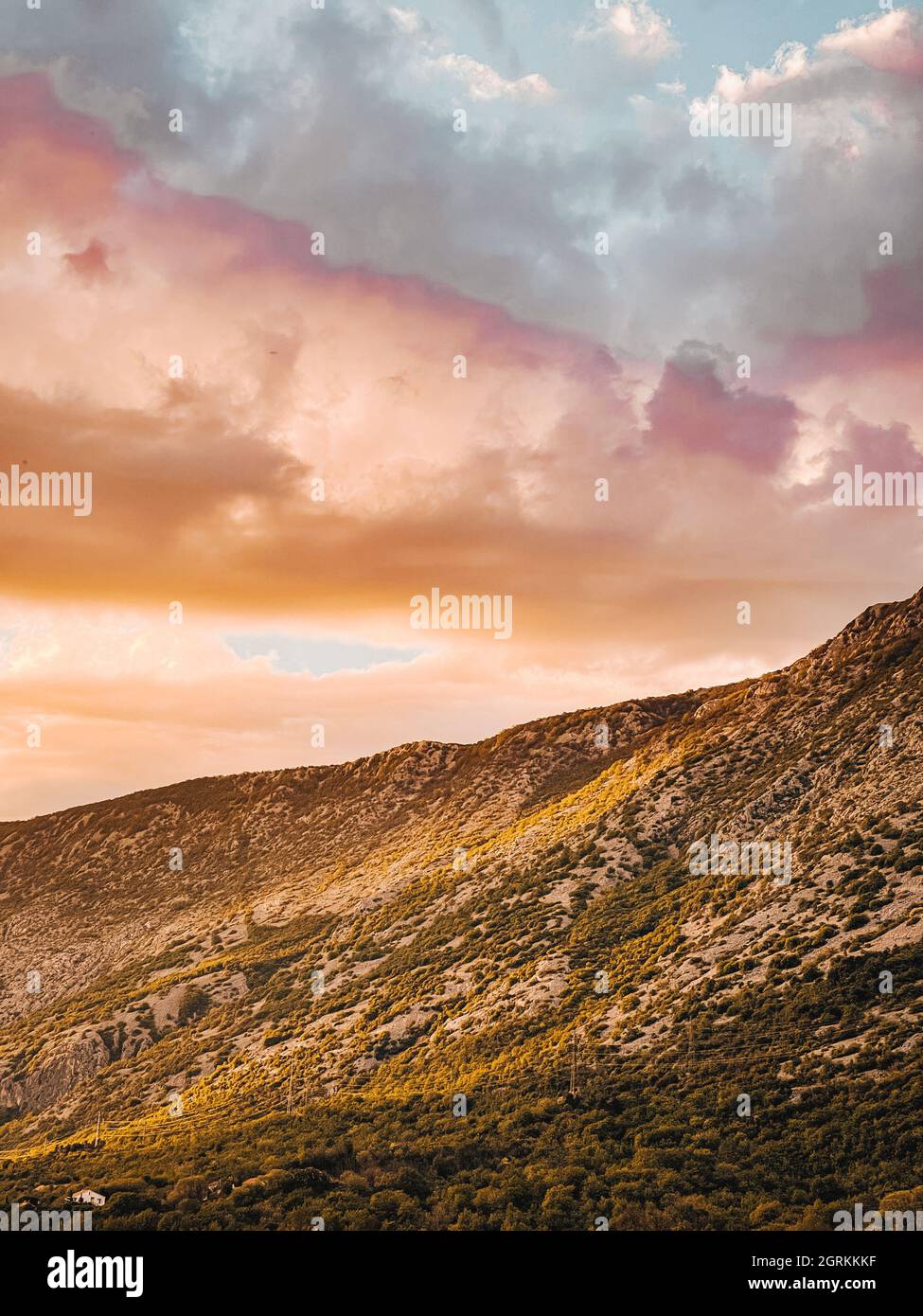 Slope of a mountain on a sunset Stock Photo - Alamy
