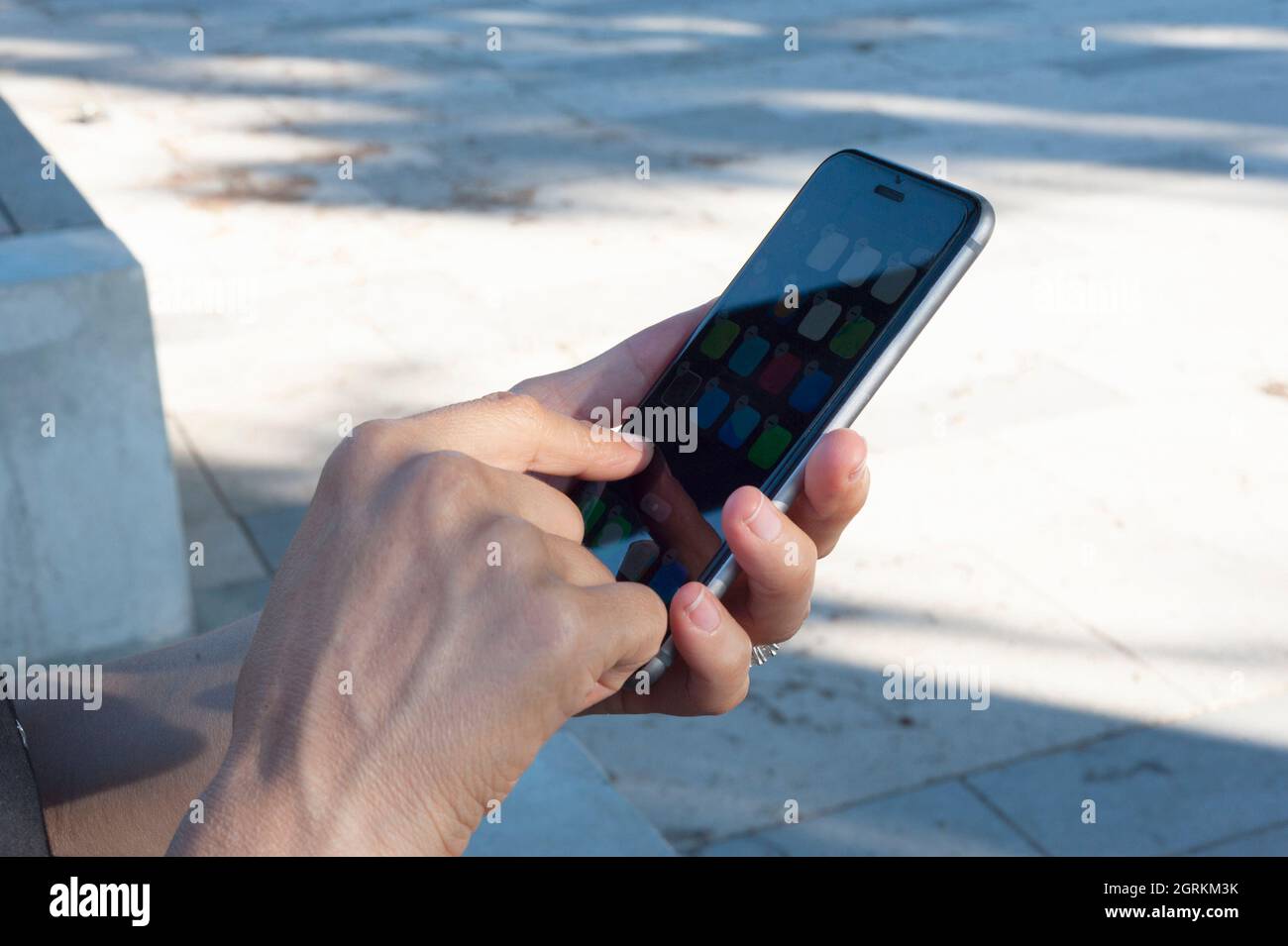 Woman while using the phone, touch the screen Stock Photo - Alamy