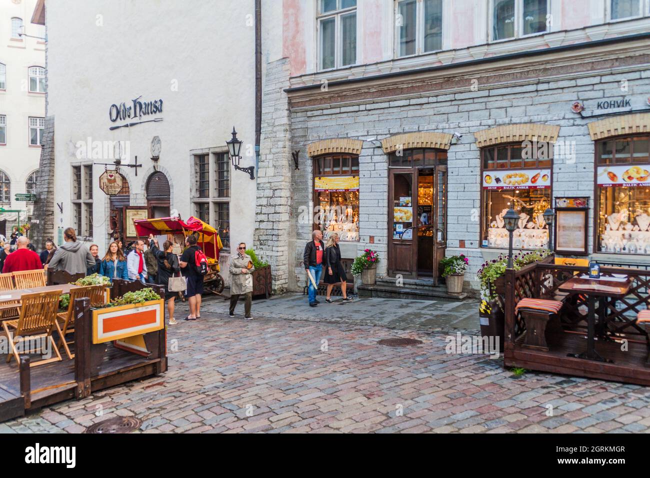 TALLINN, ESTONIA - AUGUST 23, 2016: Restaurants on a cobbled street in ...
