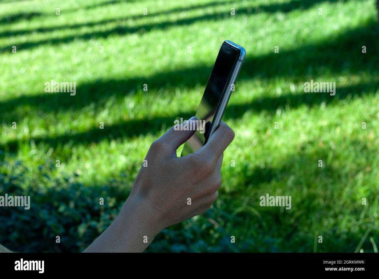 Woman while using the phone, touch the screen Stock Photo - Alamy