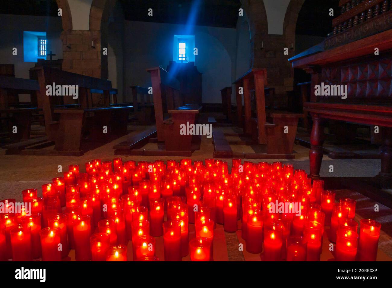 Candle offerings in a church on the Way of St. James Stock Photo - Alamy
