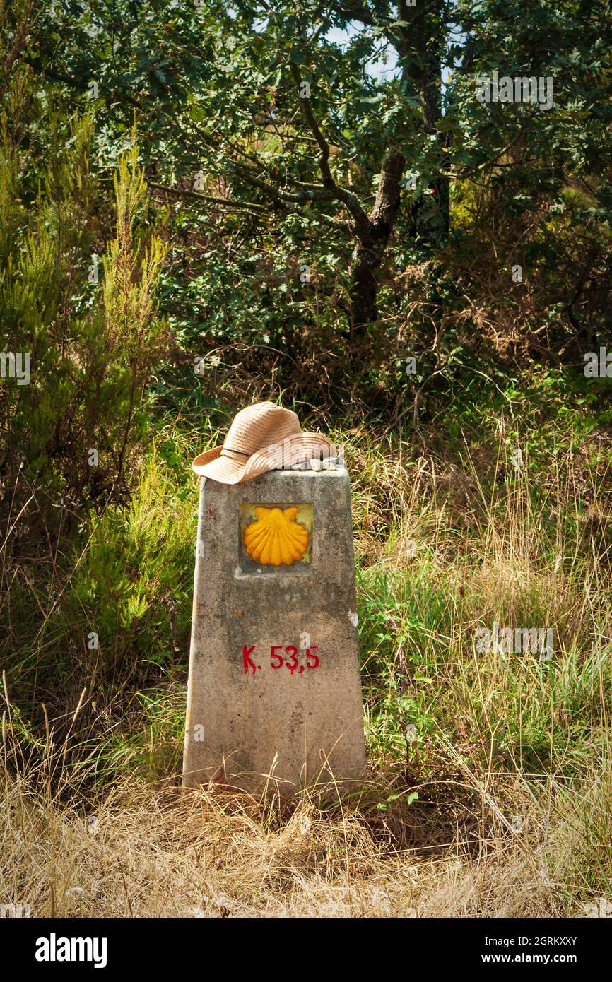 A pilgrim's hat abandoned on top of a kilometer post on the Camino de ...