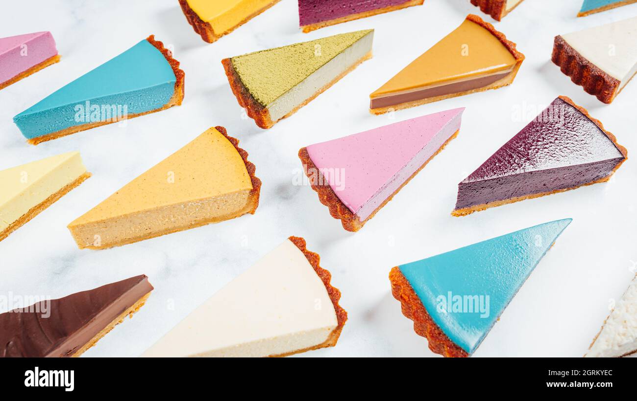 Vegan cakes cut in a triangle shape on a white background Stock Photo ...