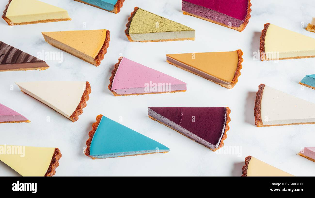 Vegan cakes cut in a triangle shape on a white background Stock Photo ...