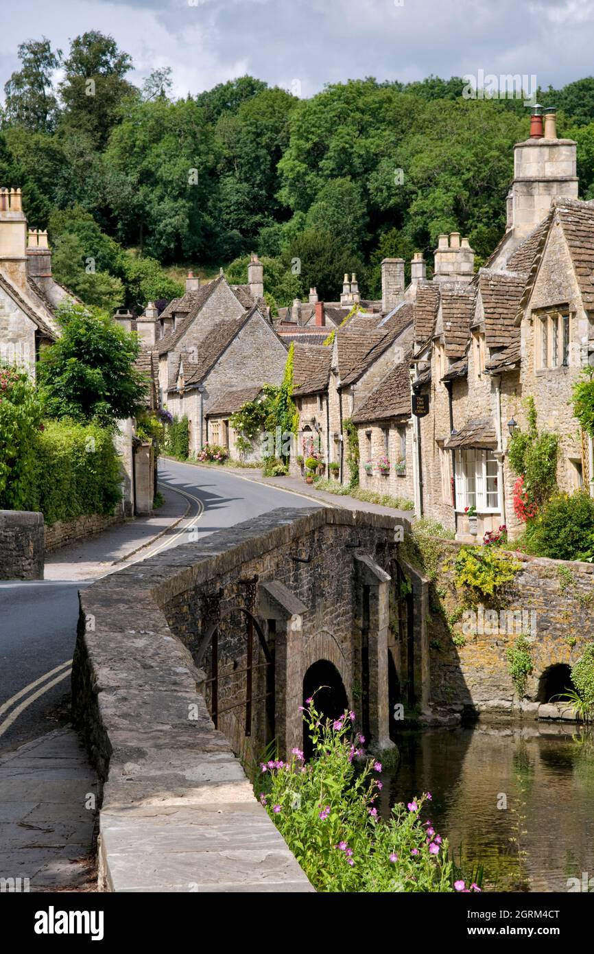 The picturesque village of Castle Combe in the Cotswolds, England in ...